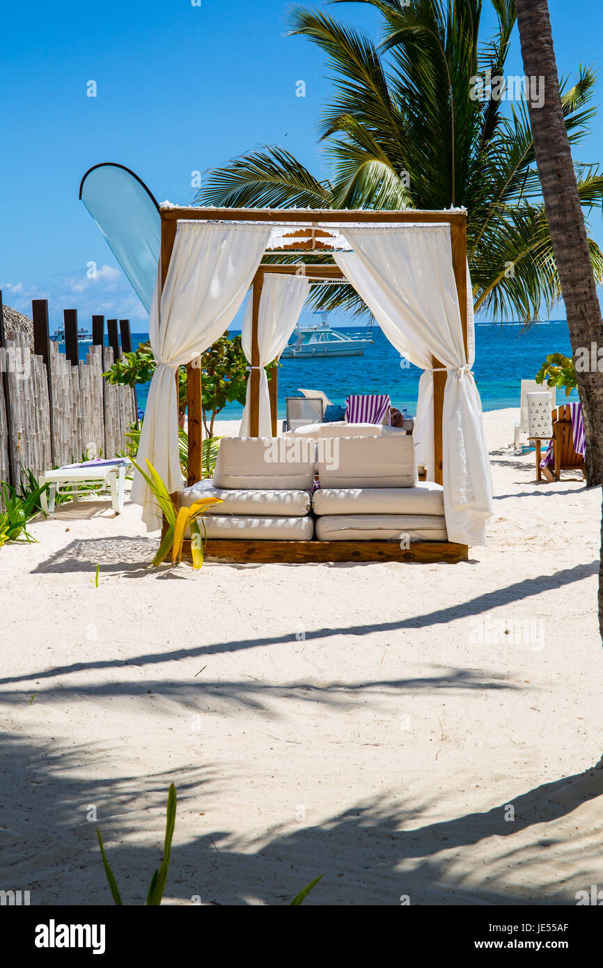 Relax on a luxury VIP beach with nice pavilion in a sunshine blue sky ...