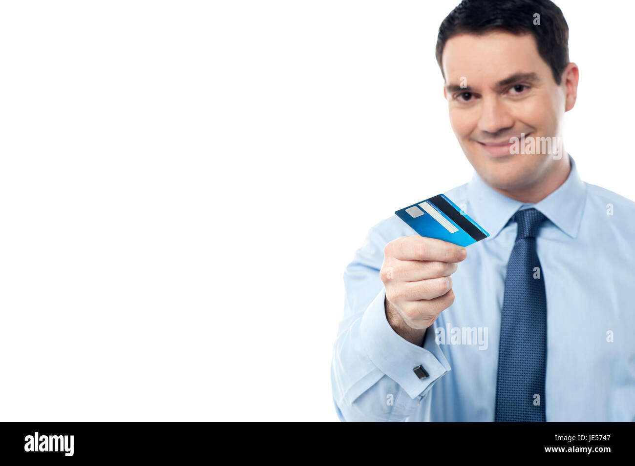 Smart corporate guy showing his debit card Stock Photo - Alamy