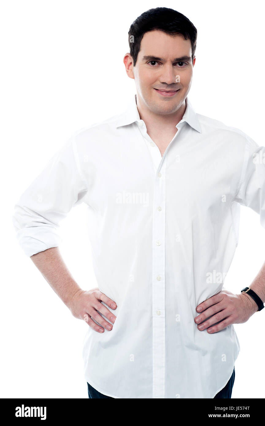 Handsome smart man posing with hand on hips Stock Photo - Alamy