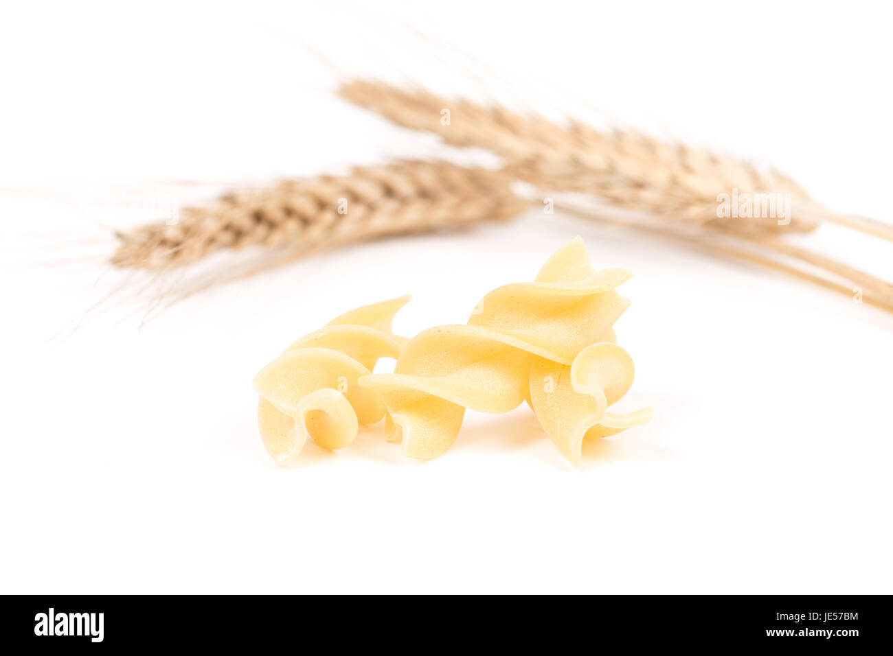 fusilli dry pasta isolated on white background Stock Photo - Alamy