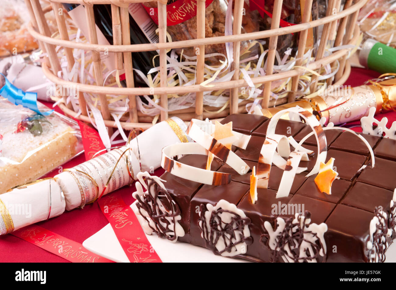 Christmas chocolate cake with a hamper basket at the background Stock ...