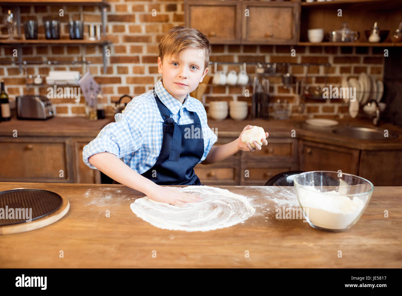 Boy making pizza hi-res stock photography and images - Alamy