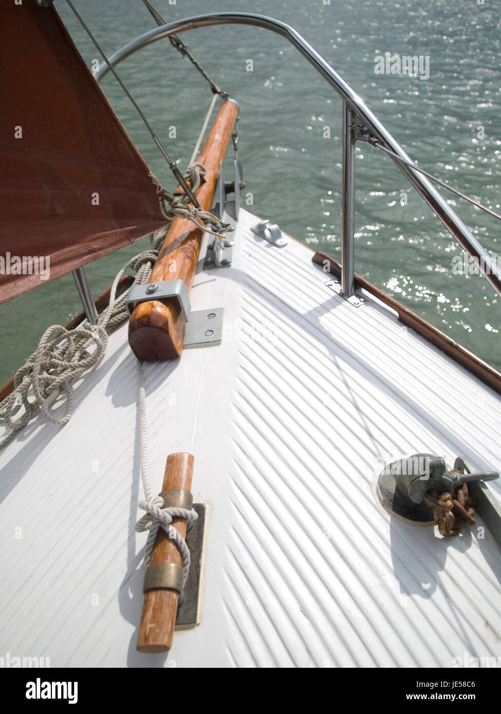 Close up view of the bow and bowsprit on a traditional sailing yacht ...