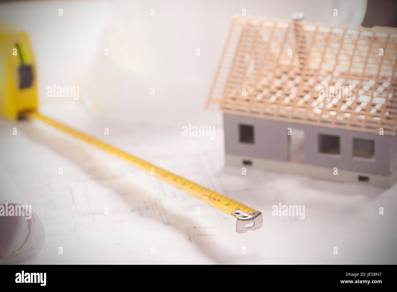 Construction plans and blueprints on wooden table Stock Photo - Alamy