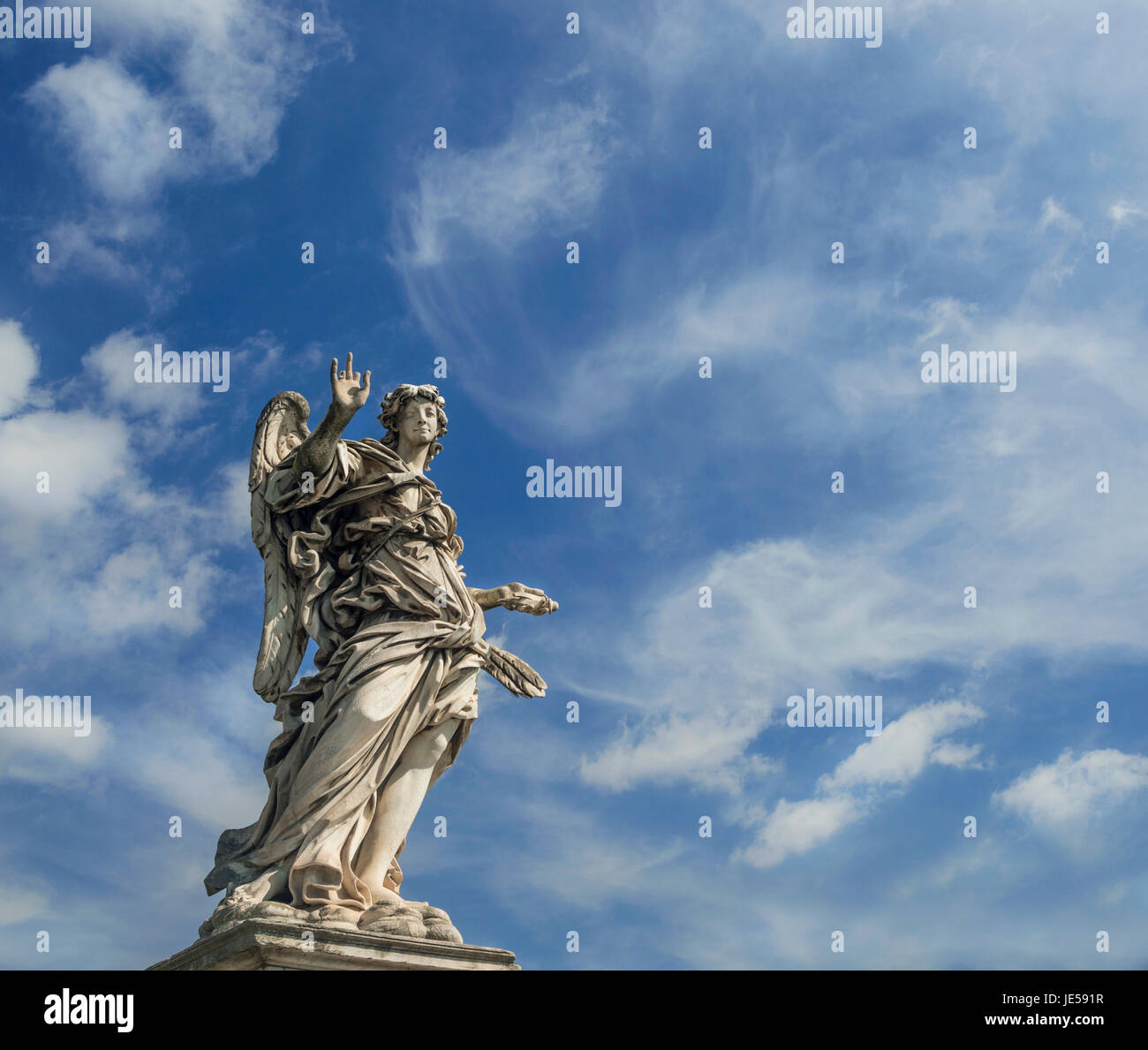 Angel statue holding the Nails of Holy Cross with heavenly sky on Sant ...