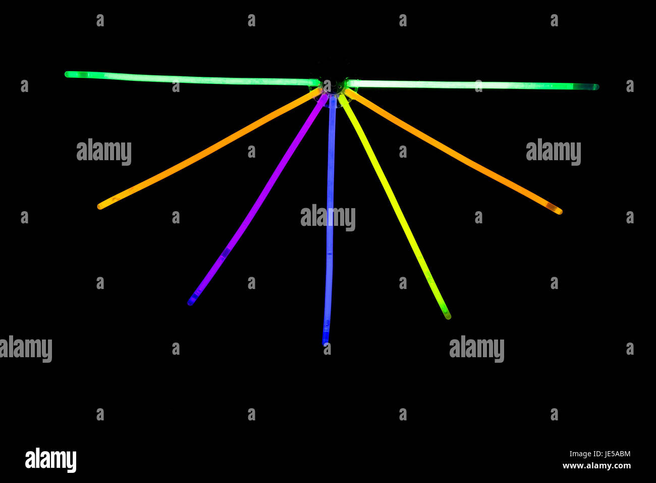 Glow sticks neon light fluorescent on back background. variation of ...
