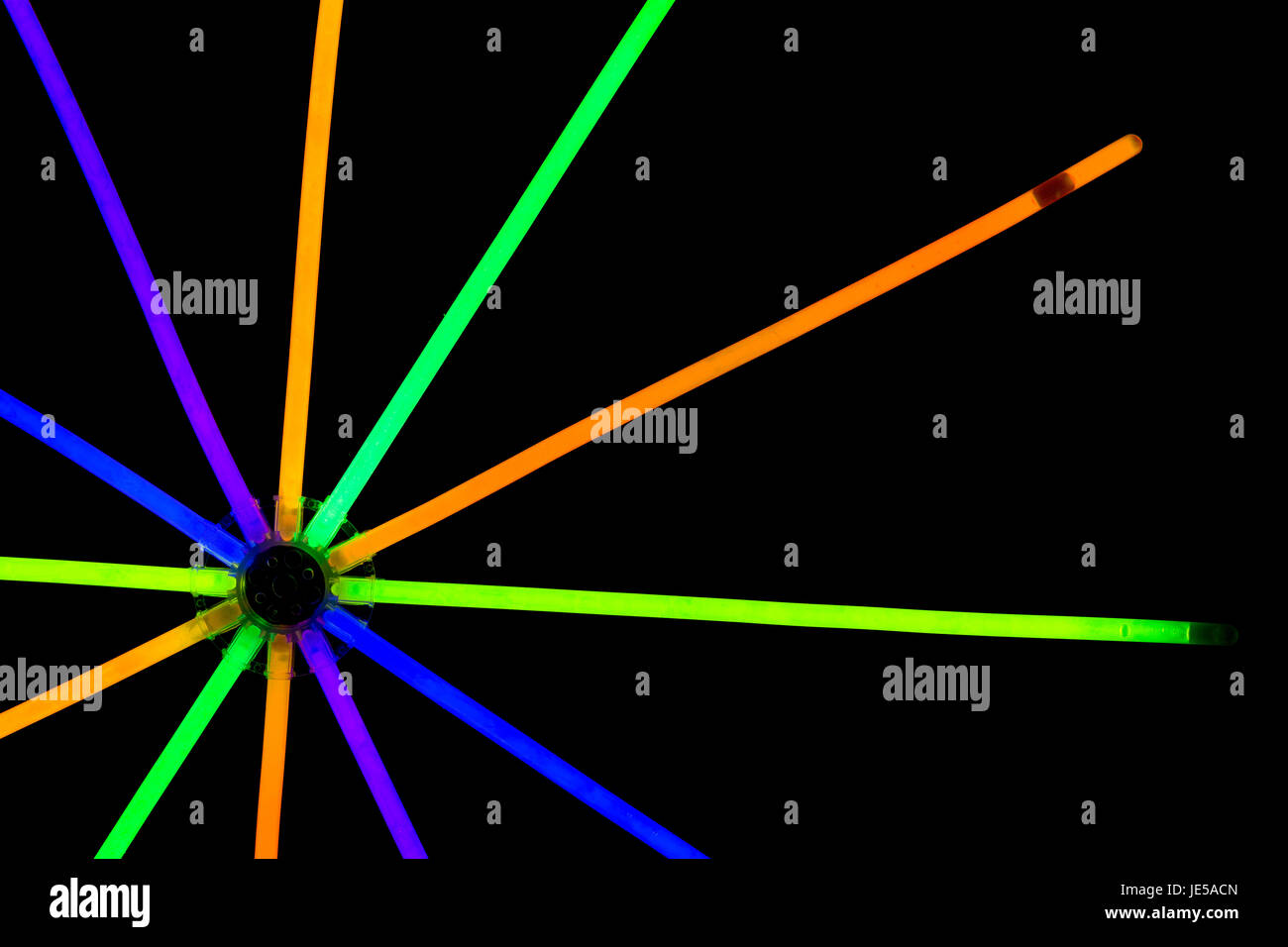 Glow sticks neon light fluorescent on back background. variation of ...