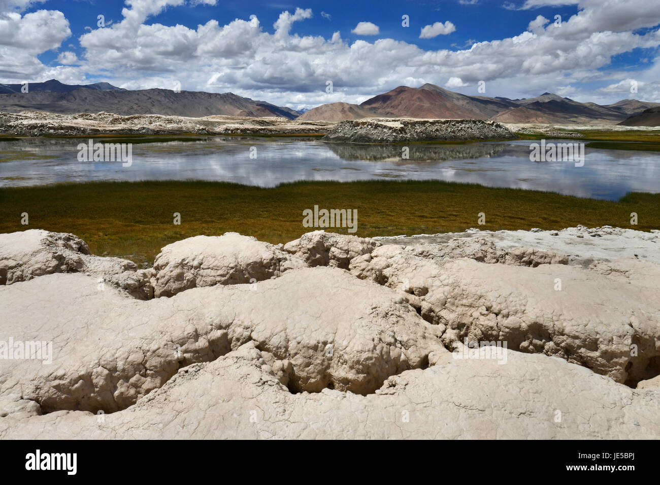 Salt Lake Tso Kar on a bright sunny summer day: in the foreground clay ...