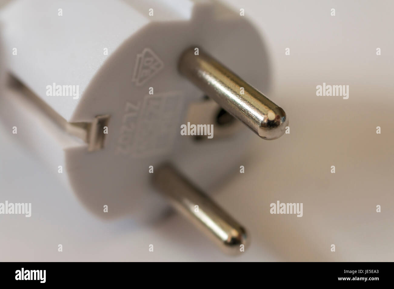 white electric plug on white background Stock Photo - Alamy