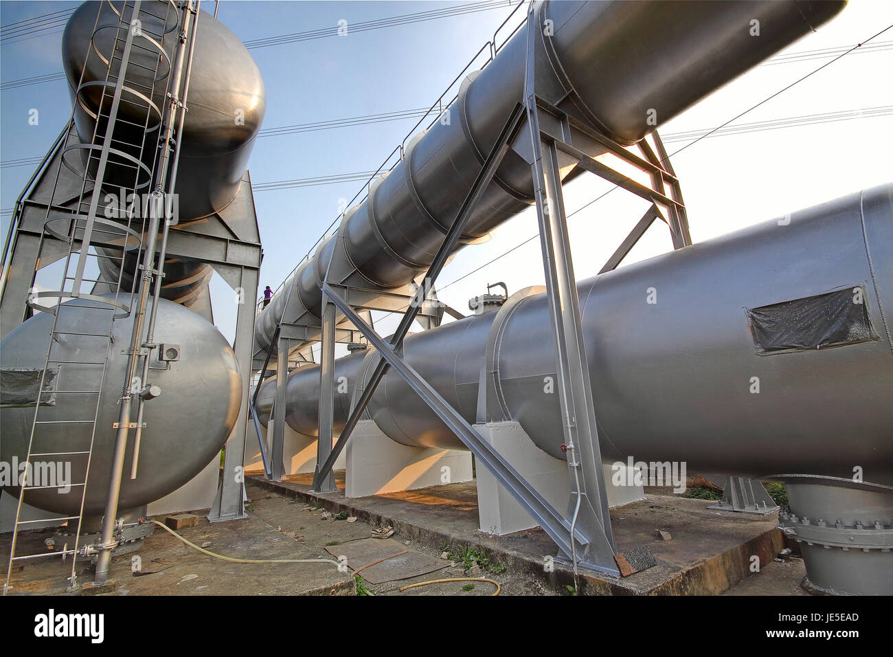 Big gas container against the blue sky Stock Photo - Alamy