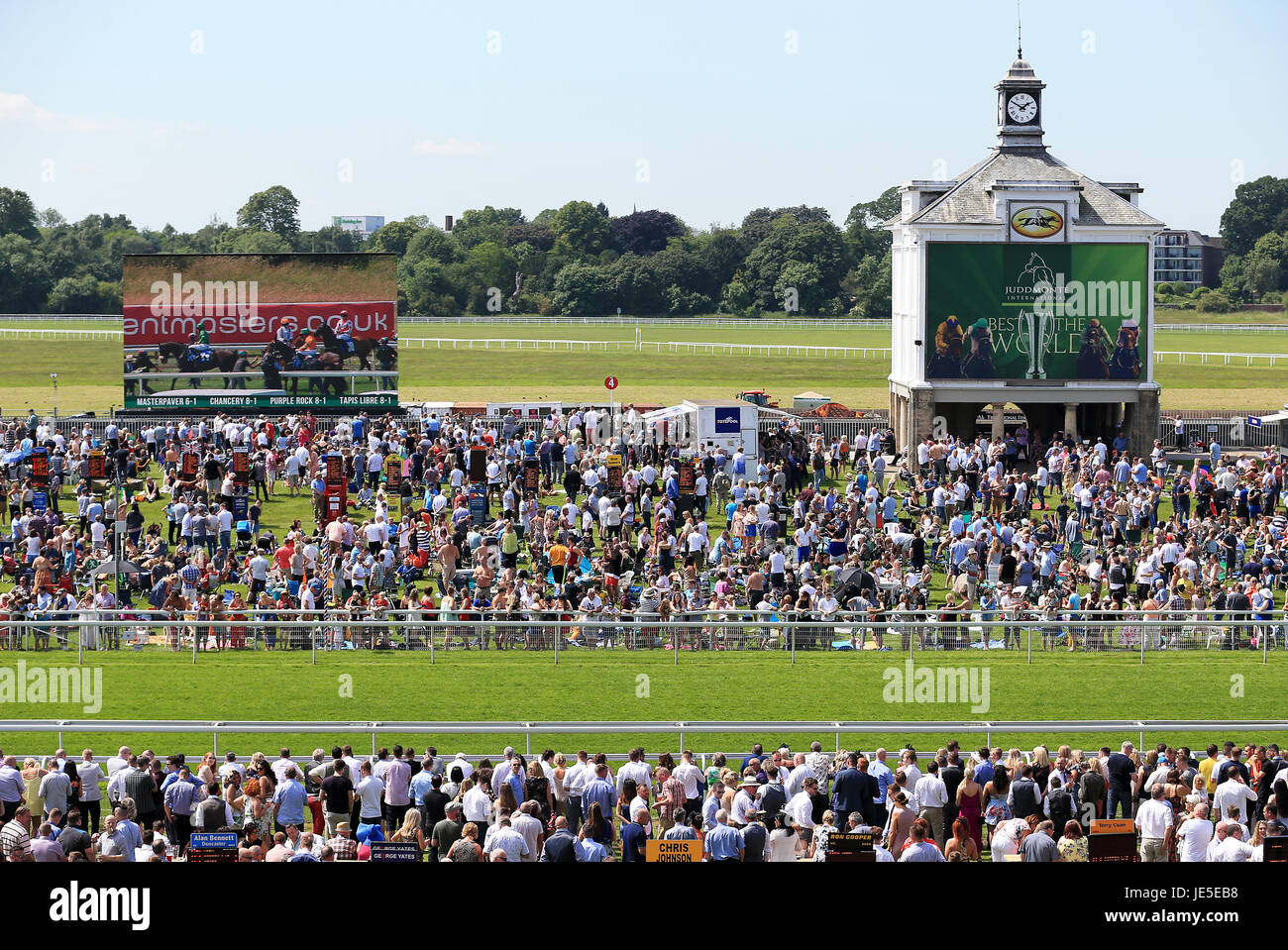A general view of spectators watching the races on the big screen at ...