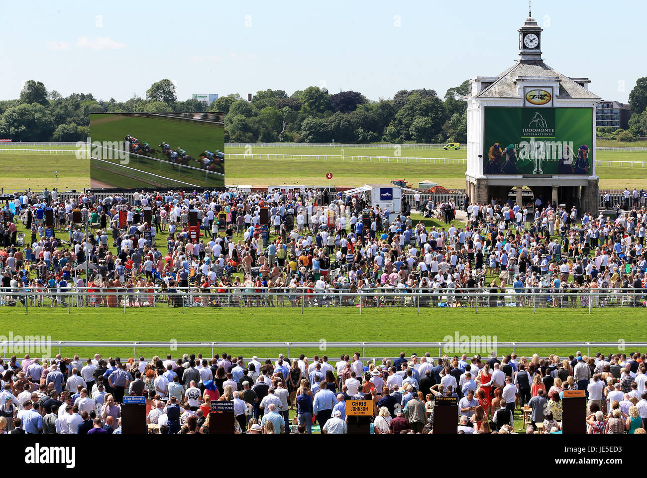 A general view of spectators watching the races on the big screen at ...