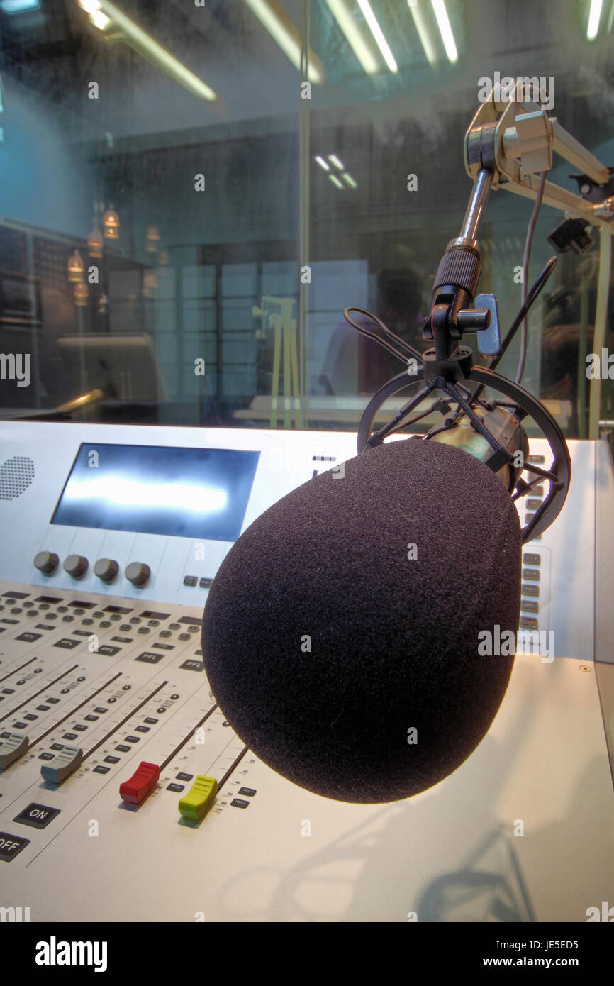 mic in front of the control panel in broadcasting studio Stock Photo ...