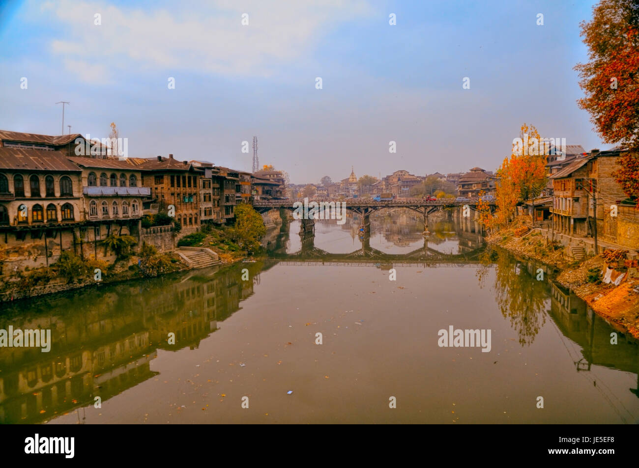 Scenic view of bridge across Jhelum river in town of Srinagar in India ...