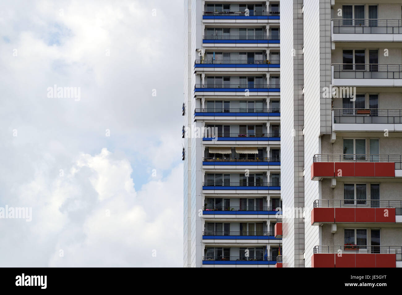 The facade of a high building with some windows closed Stock Photo - Alamy