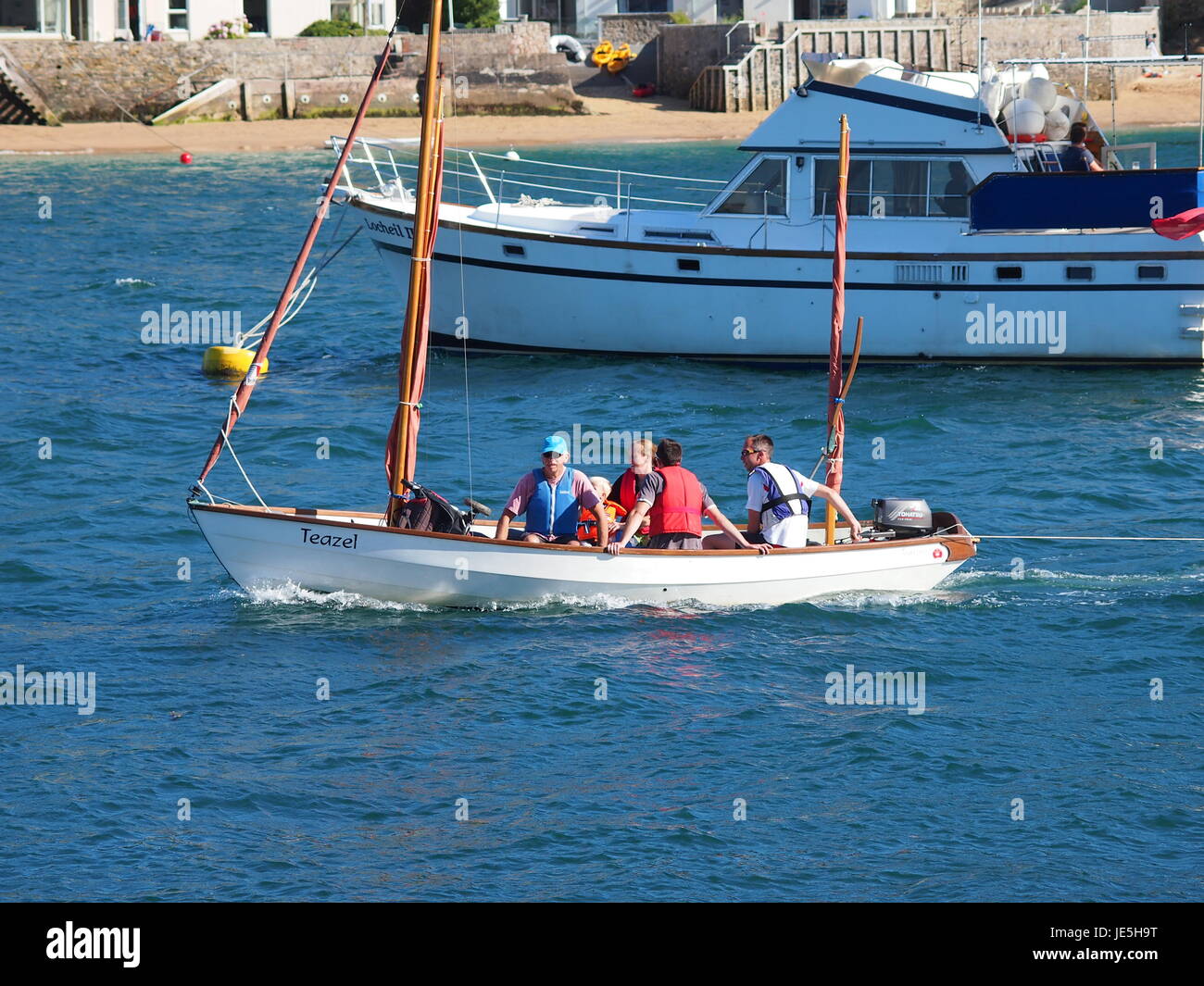 A Drascombe Lugger ferrying people along the estuary at Salcombe, Devon ...