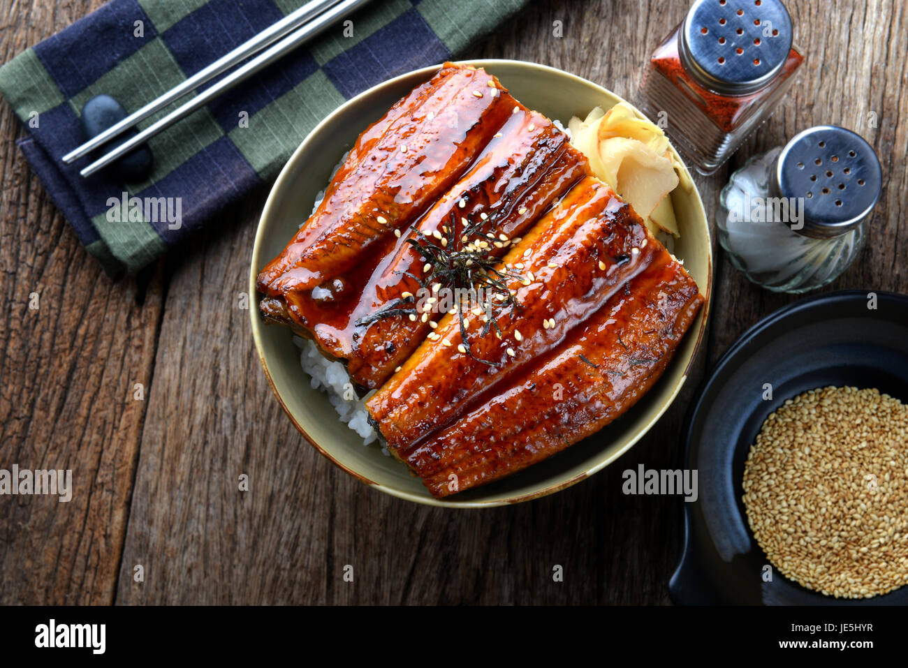 Japanese eel grilled with rice or Unagi don set on plate in Japanese style with studio lighting ...