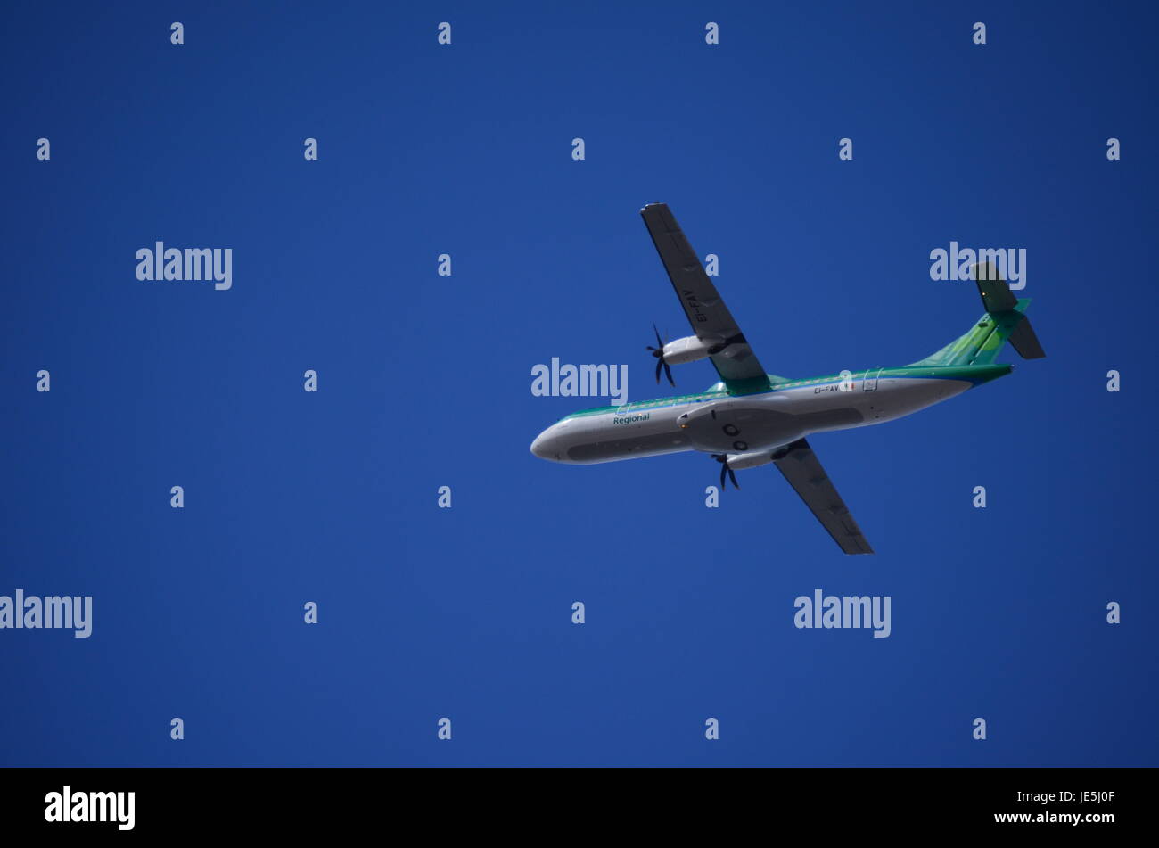Green and White Double Helix Regional Airplane Flying Left Green and ...