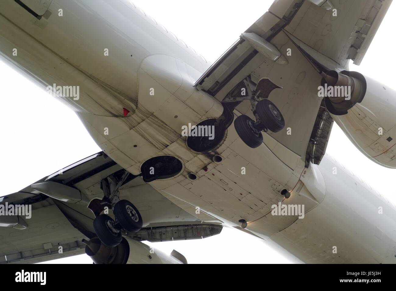 The underside of a modern airplane and its landing gear Stock Photo - Alamy