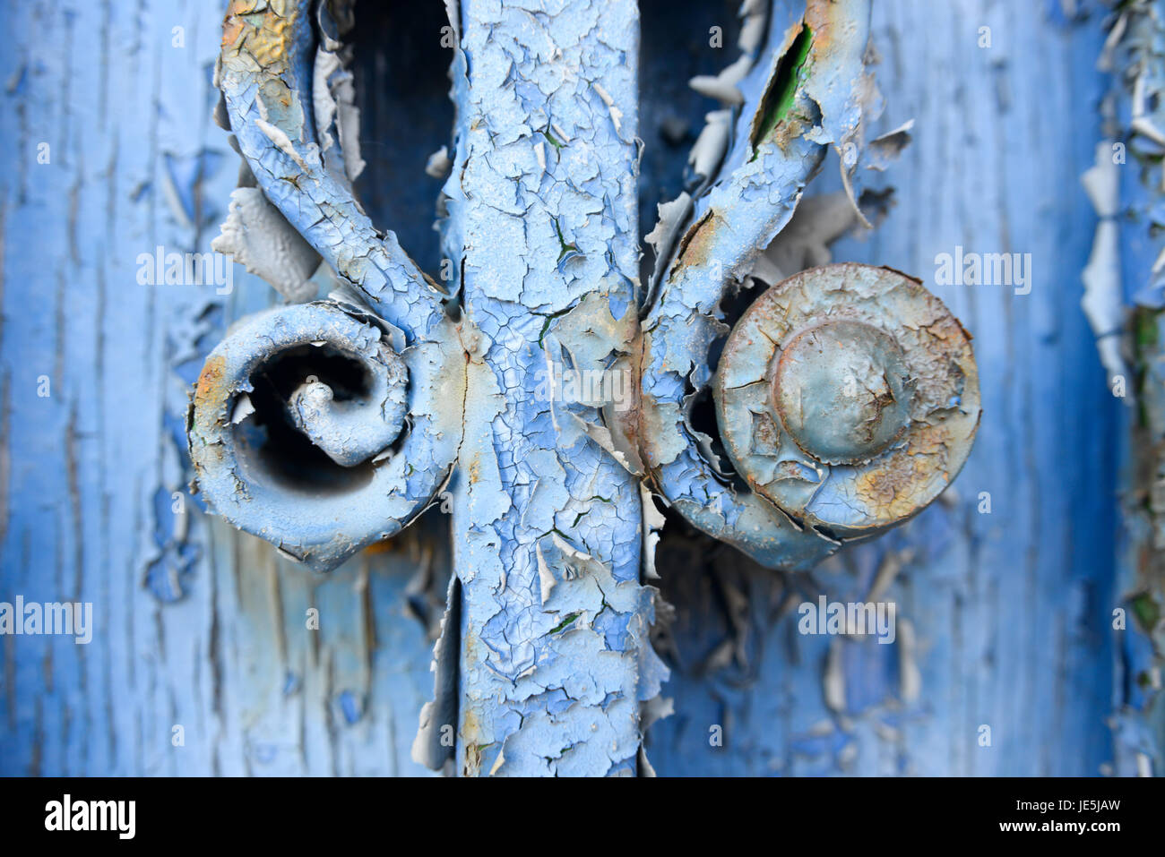 Faded and flaking paintwork on wrought ironwork Stock Photo - Alamy