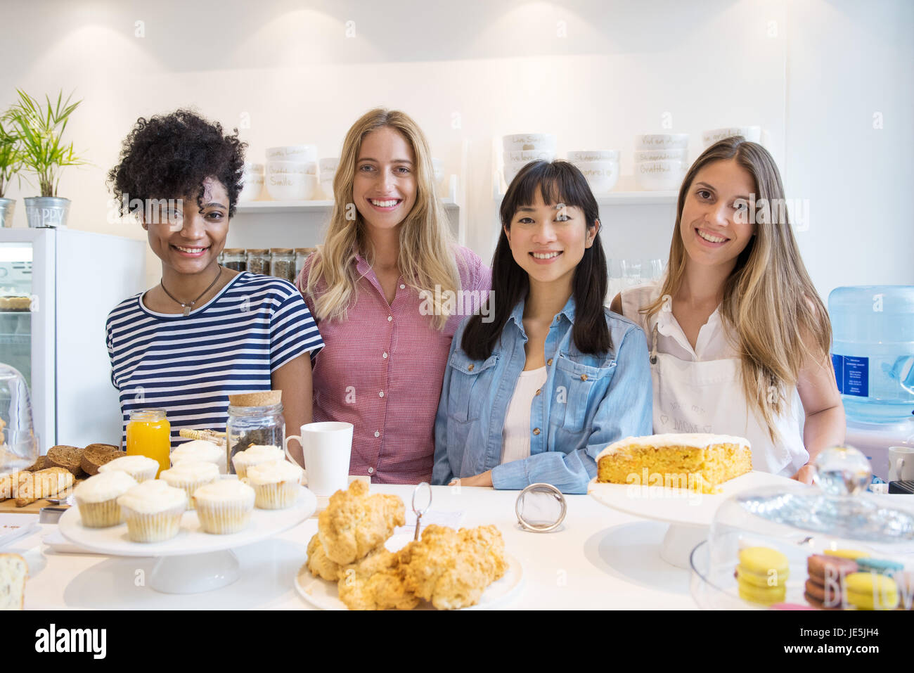 Shopkeepers in small bakery Stock Photo - Alamy