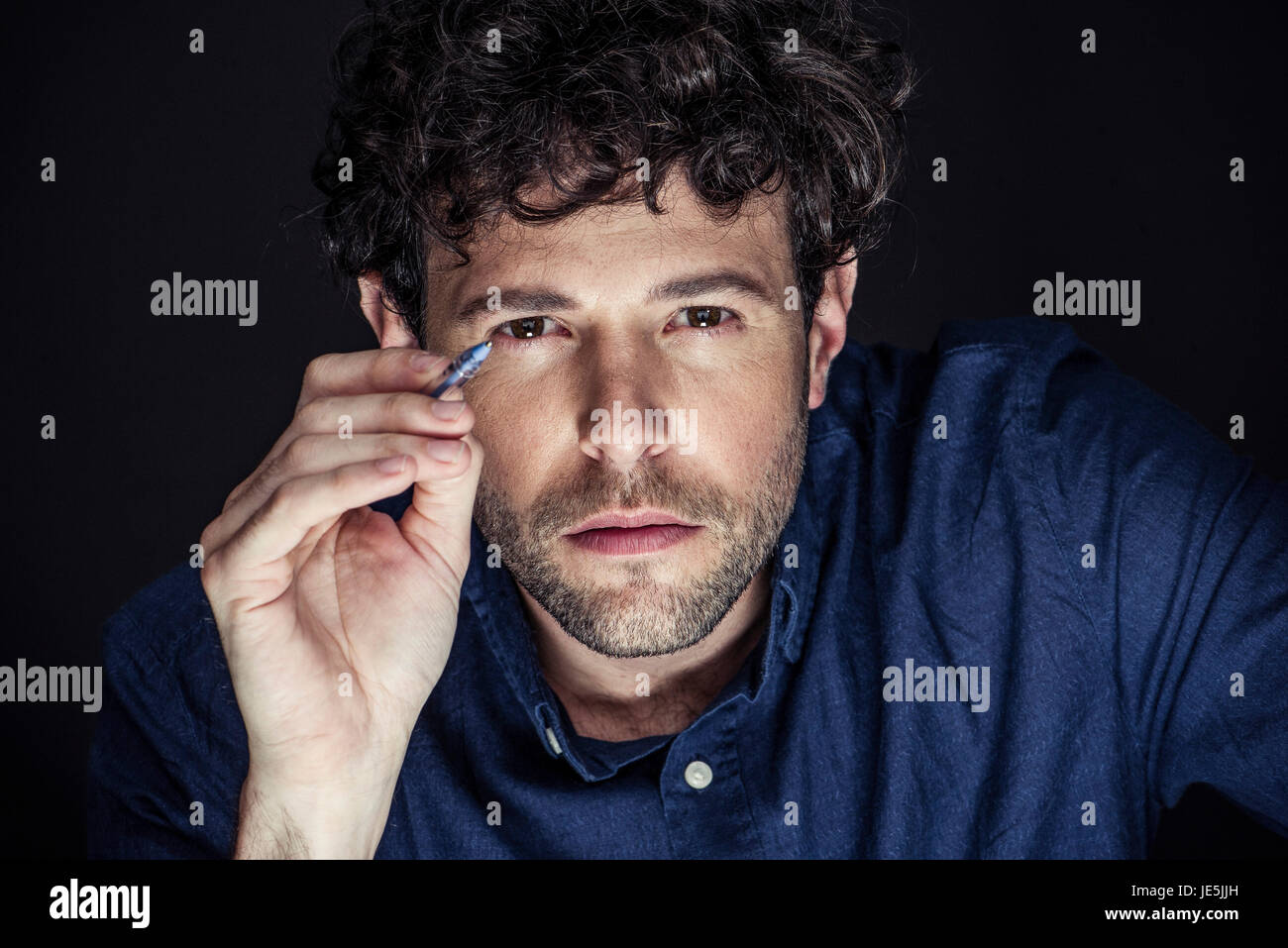 Person squinting studio hi-res stock photography and images - Alamy