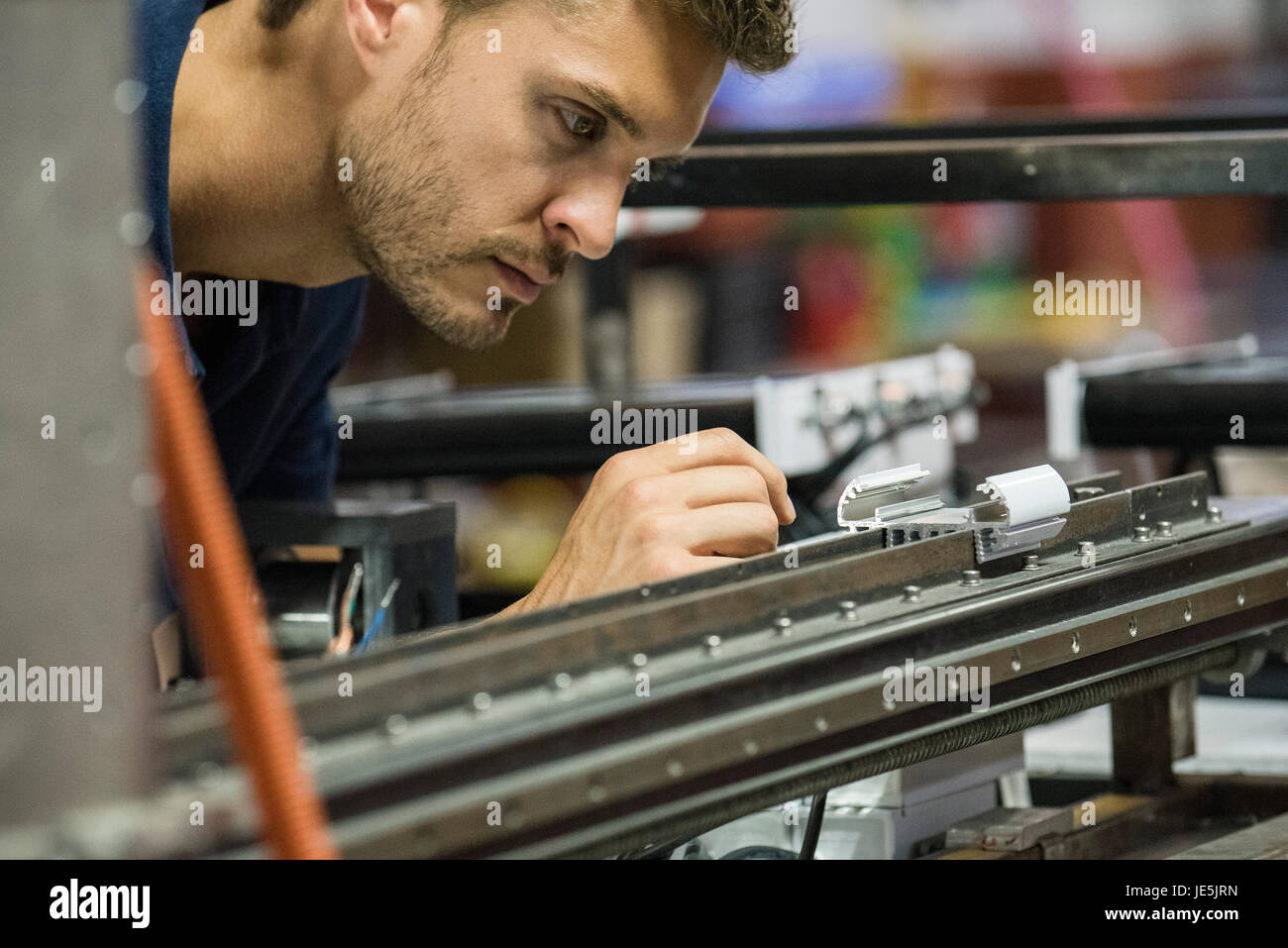 Man working in factory Stock Photo - Alamy
