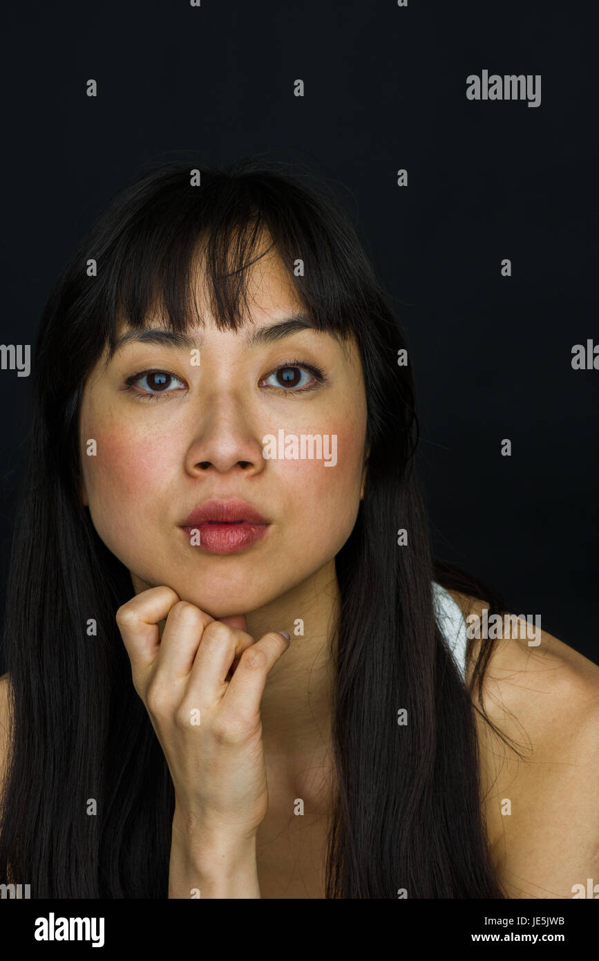 Hand under chin hi-res stock photography and images - Alamy