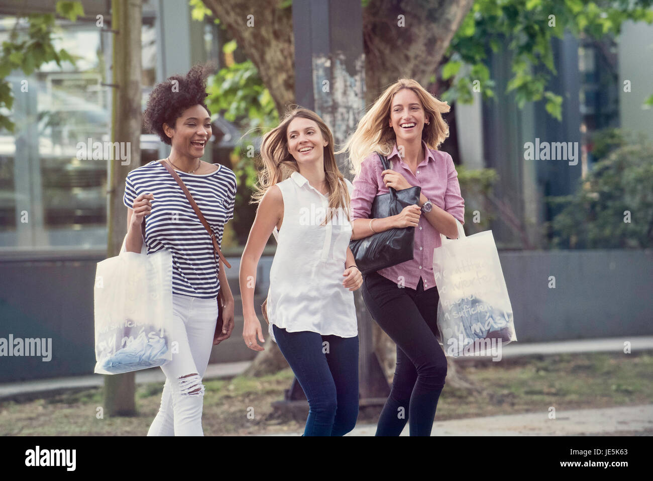 Young women shopping together Stock Photo - Alamy