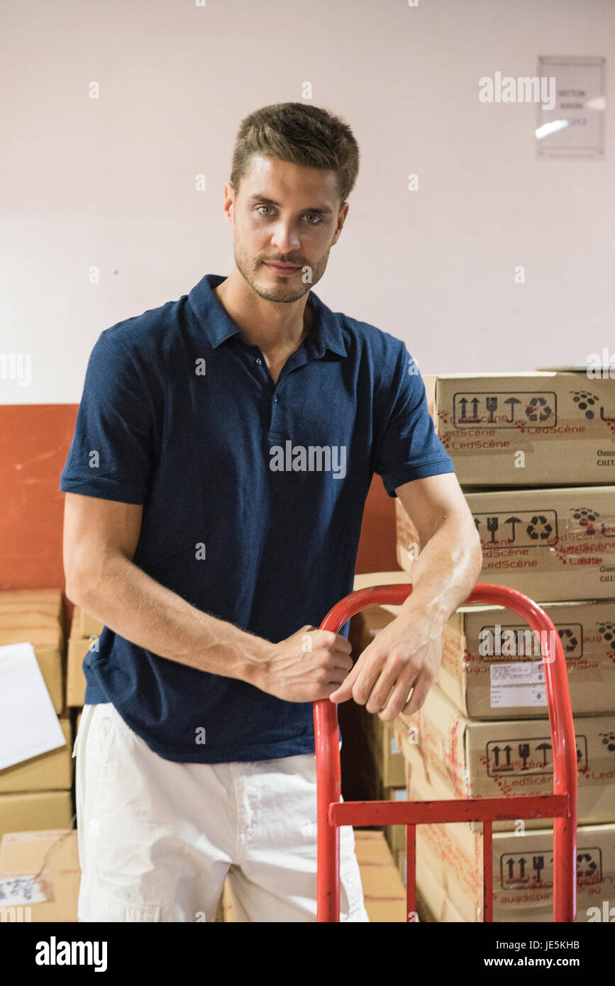 Man working in warehouse Stock Photo - Alamy