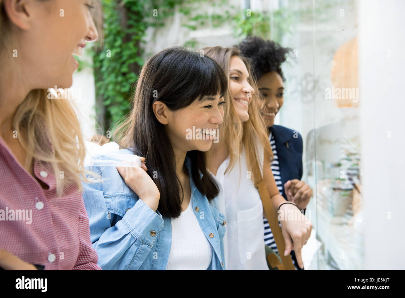 Friends window shopping together Stock Photo - Alamy
