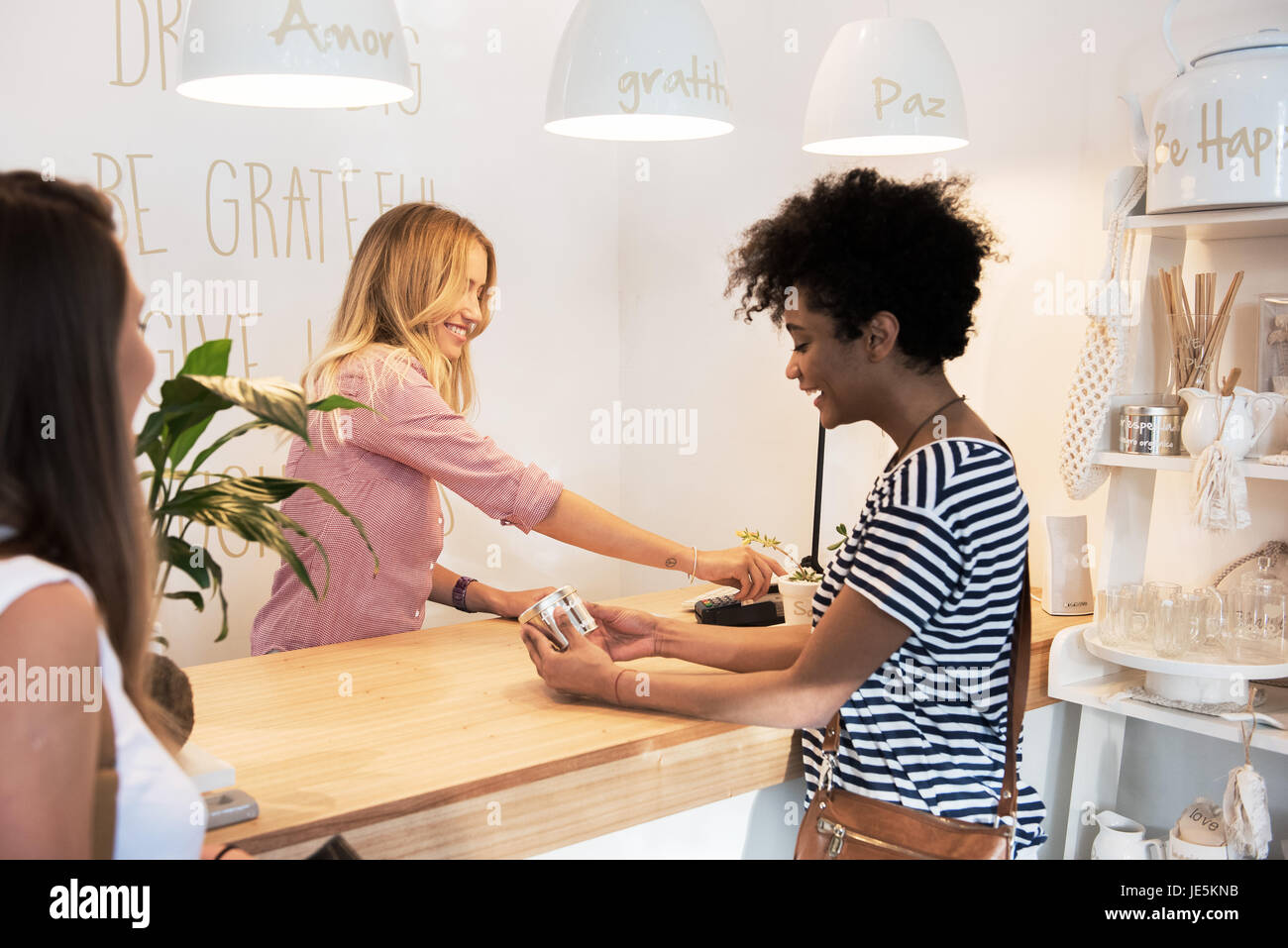 Young caucasian women making purchase hi-res stock photography and ...