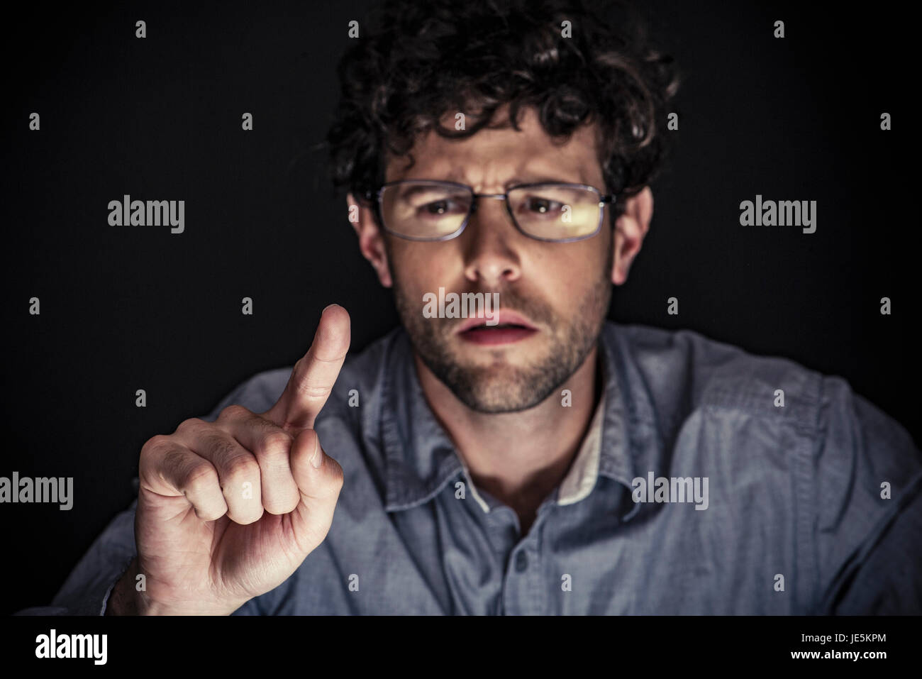Person touching transparent screen hi-res stock photography and images ...