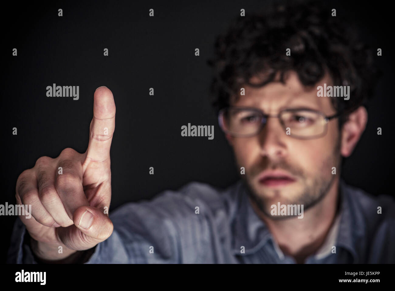 Man using index finger on transparent touch screen Stock Photo - Alamy