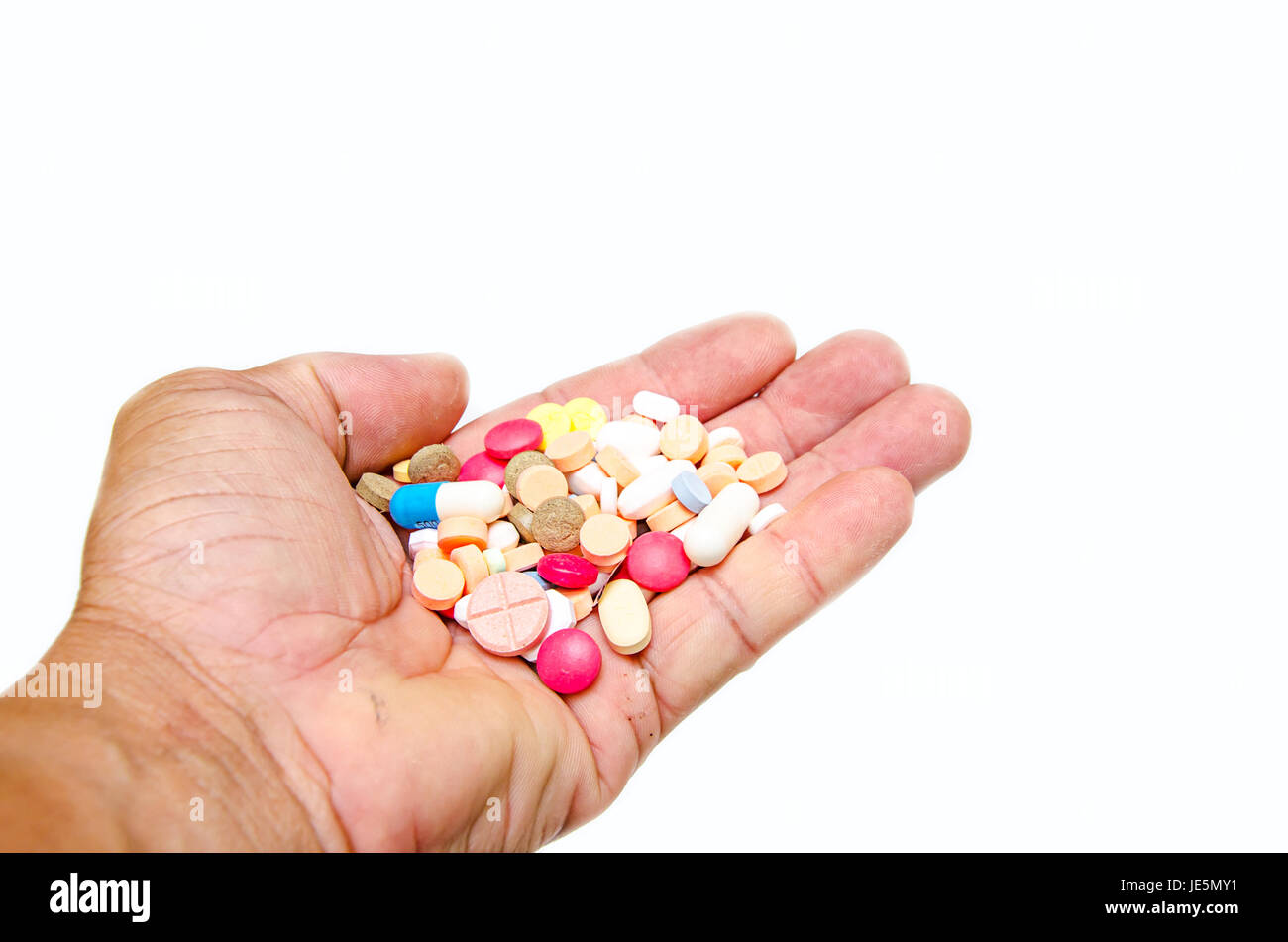 colorful of medicine in hand for treatment on white background Stock ...
