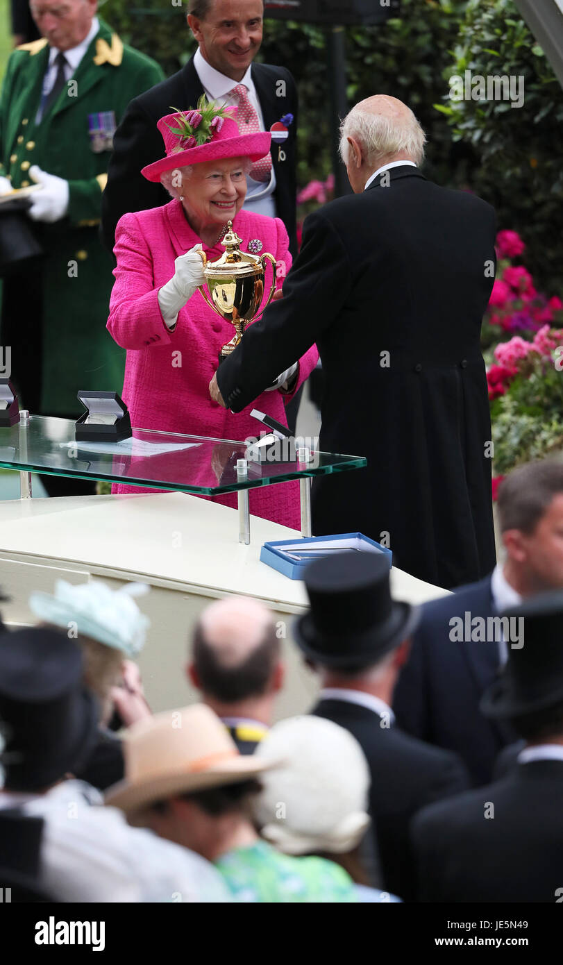 Queen Elizabeth II holds the trophy to be presented to the winner of ...