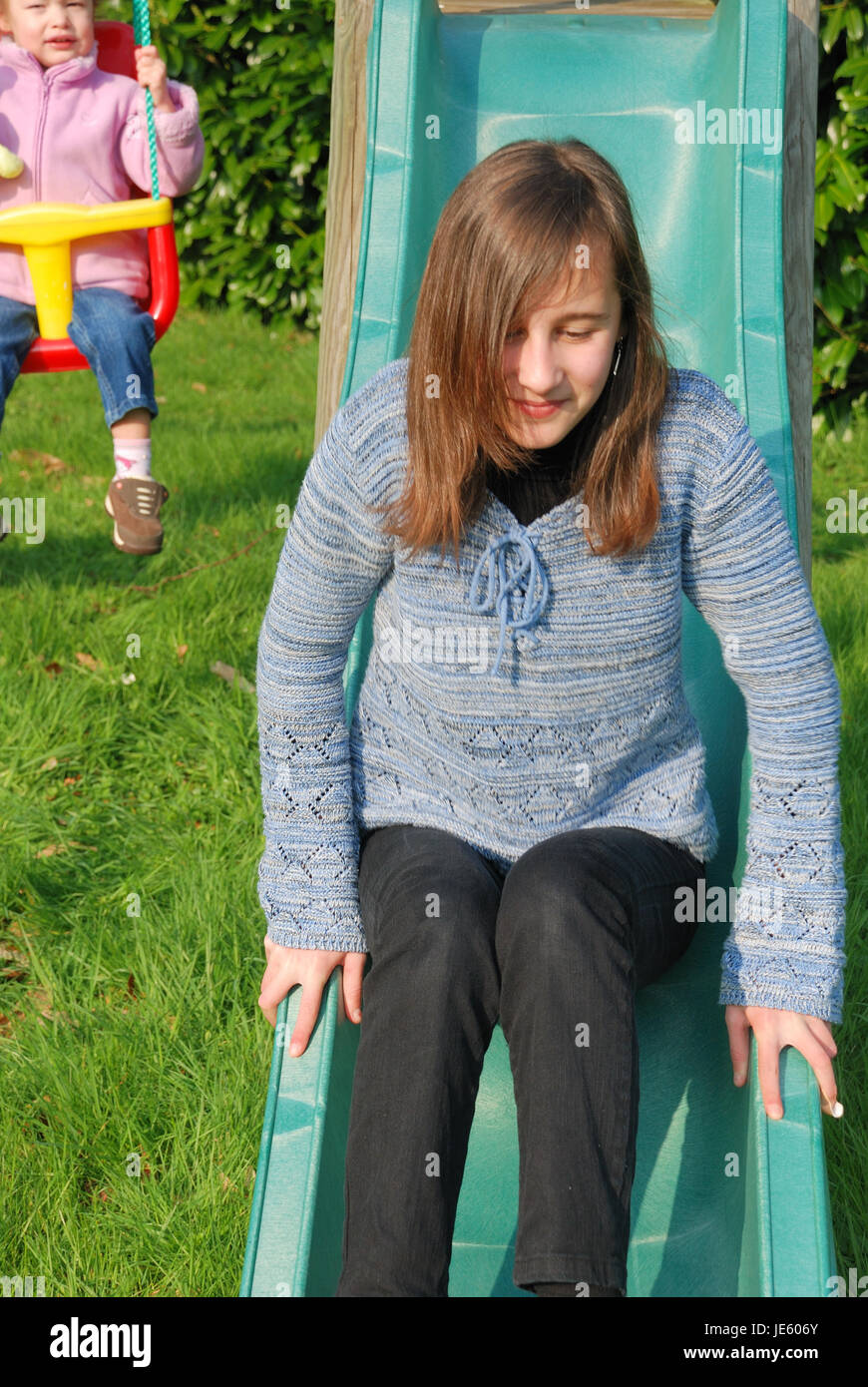 Girl on slide Stock Photo - Alamy