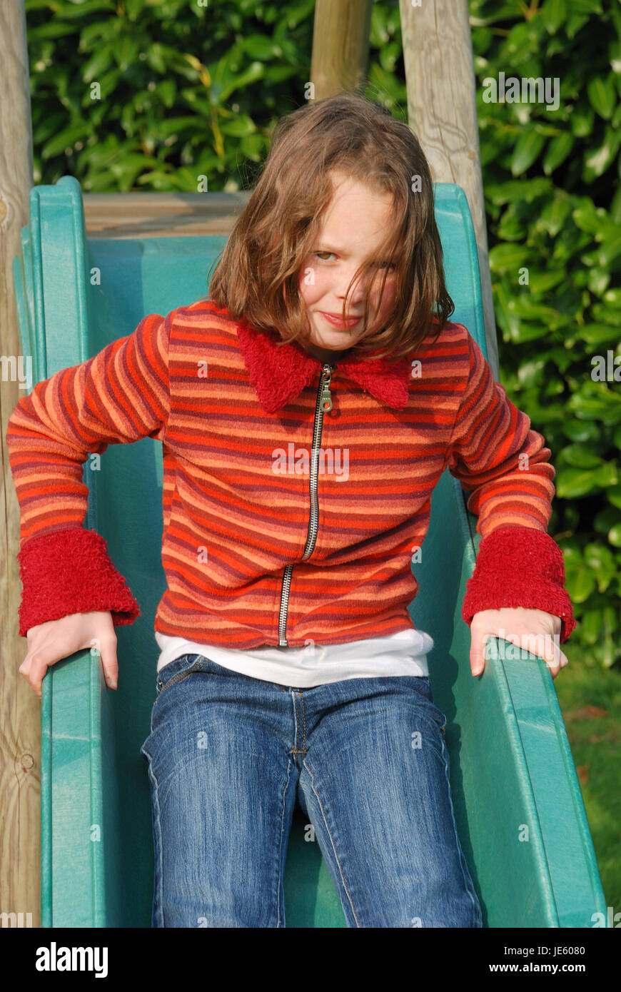 Girl on slide Stock Photo - Alamy