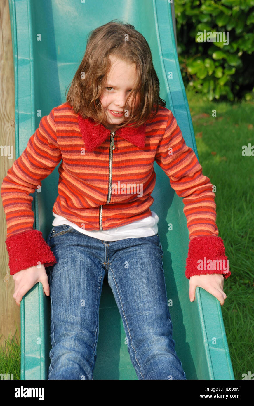 Girl on slide Stock Photo - Alamy