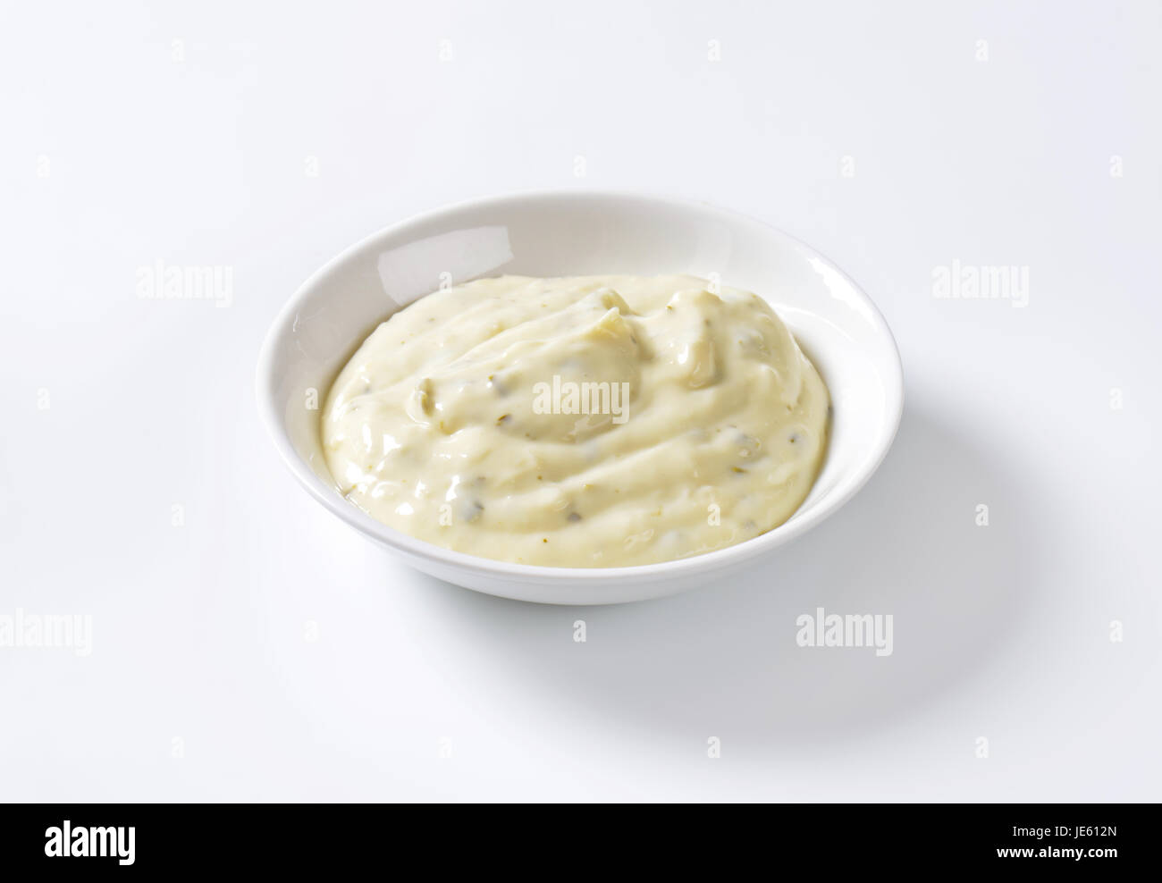 Creamy salad dressing made of mayonnaise, buttermilk, garlic, herbs ...