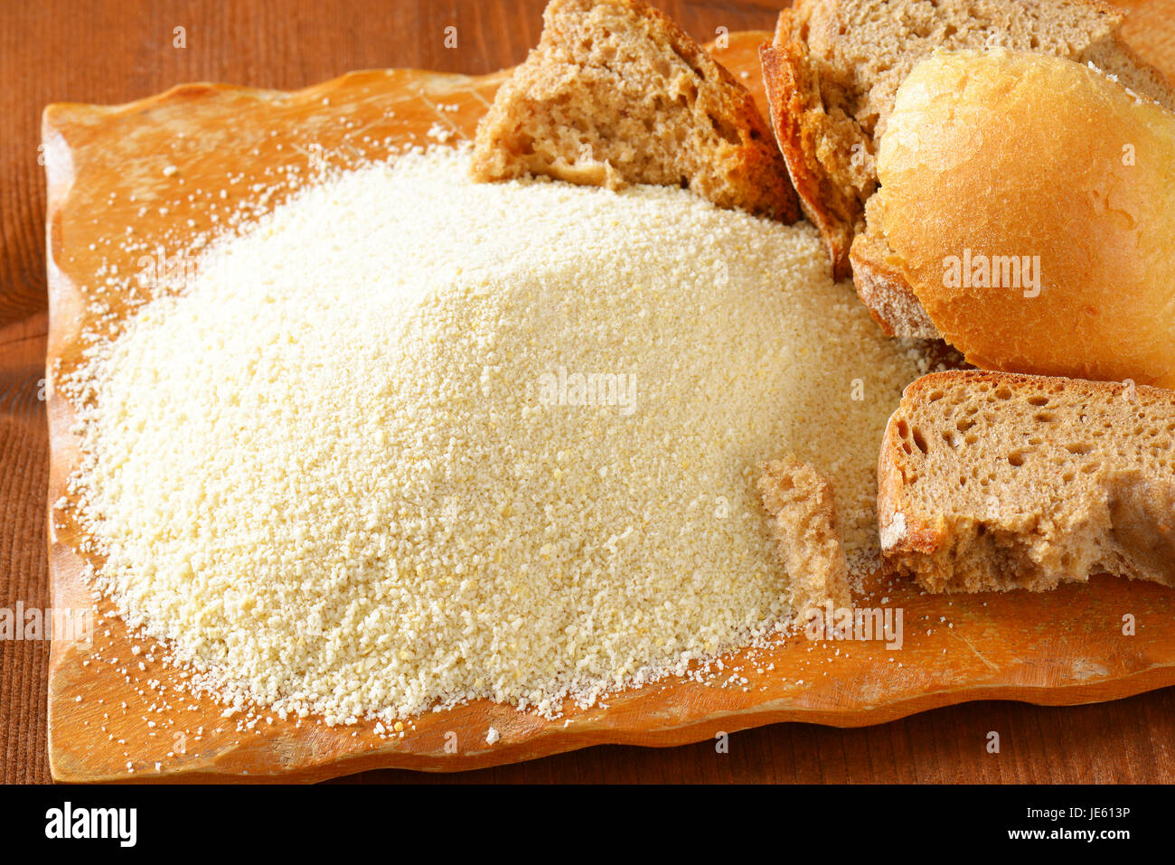 Pieces of stale bread and pile of finely ground bread crumbs Stock ...