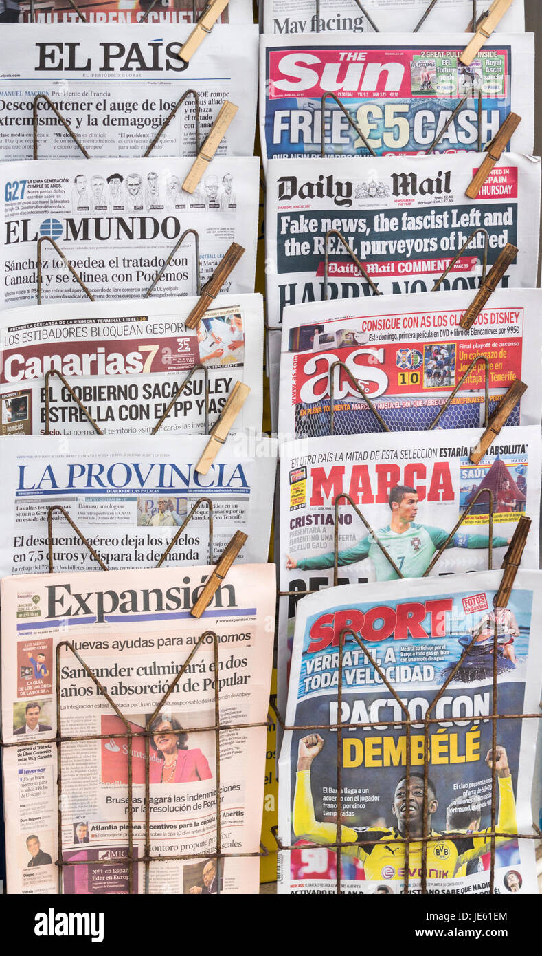 English and Spanish newspapers outside nes kiosk in Spain Stock Photo ...