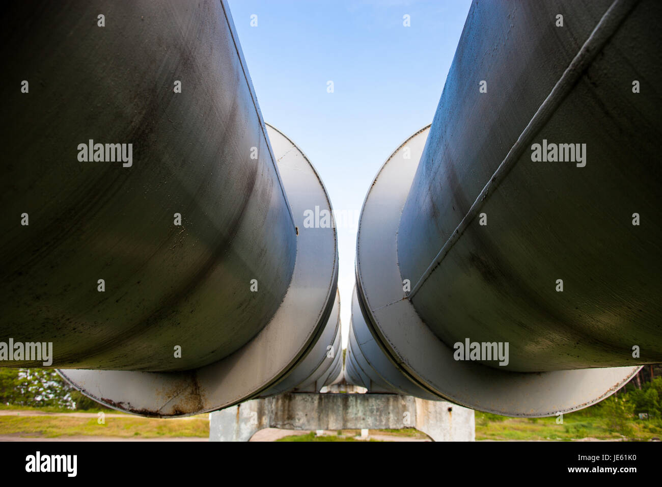 Close up of two elevated parallel pipelines Stock Photo - Alamy