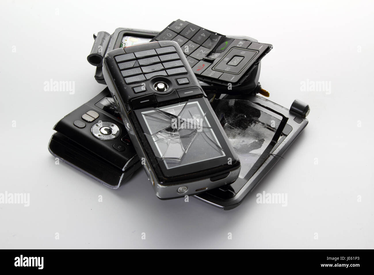 Broken Mobile Phones on Seamless White Background Stock Photo - Alamy