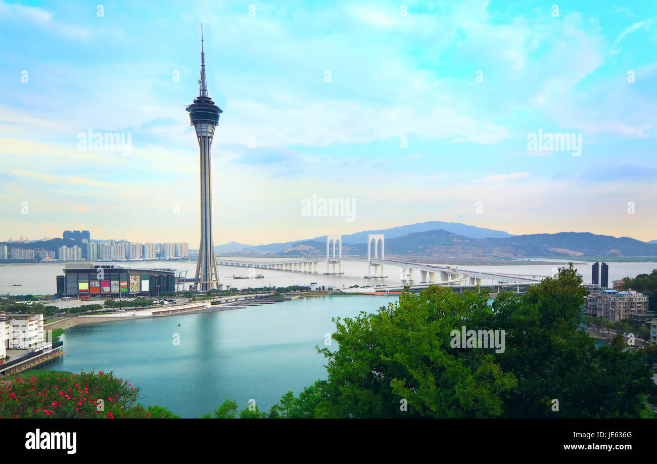 Urban landscape of Macau with famous traveling tower under blue sky ...
