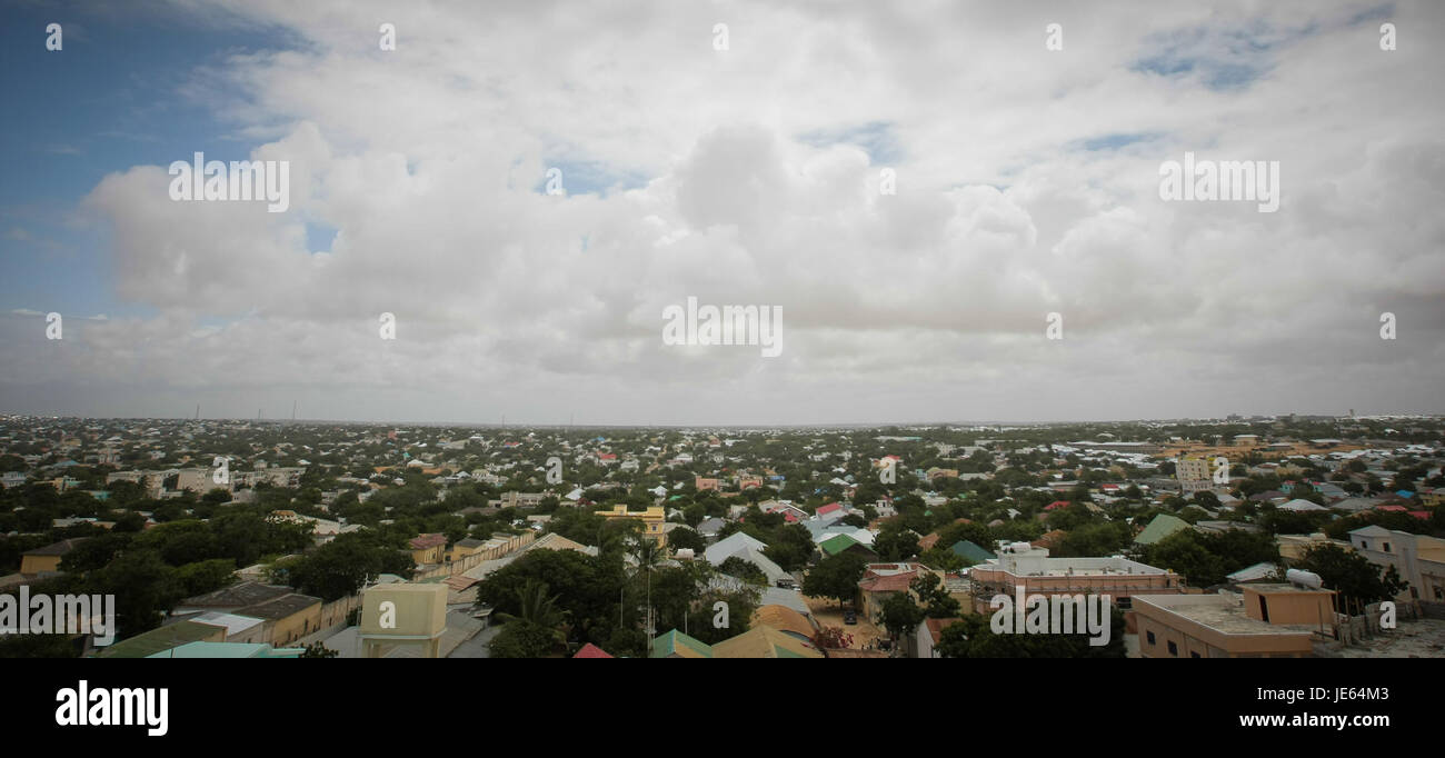 This image captures daily life in Mogadishu, Somalia, showing the ...
