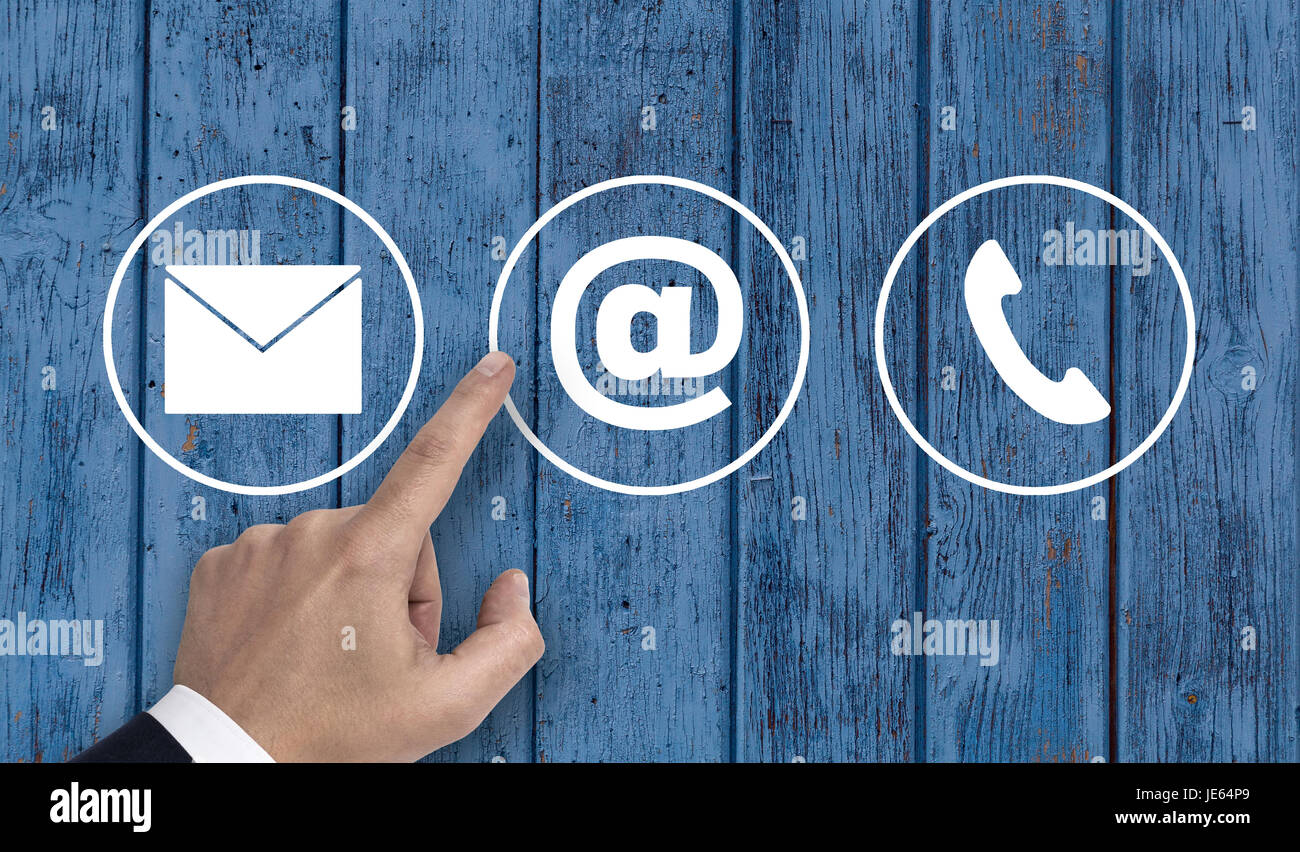 Hand pointing at contact options Stock Photo - Alamy