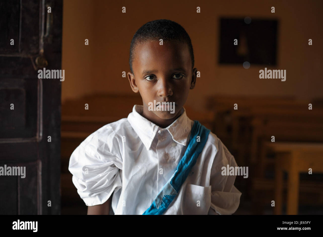 This image captures the event of a school handover, marking the ...