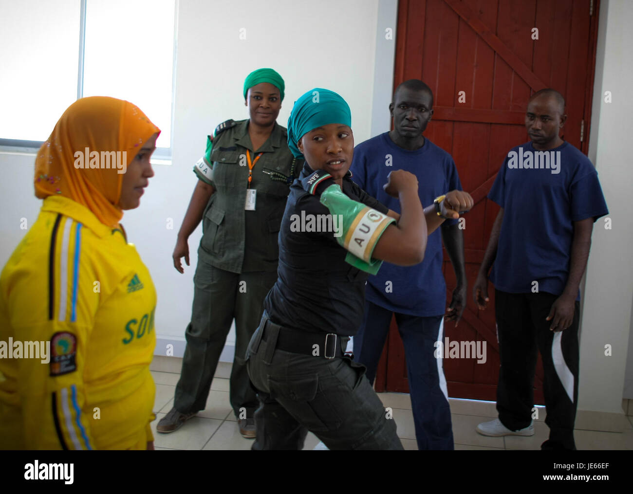 This image captures a moment from a women’s self-defense training ...