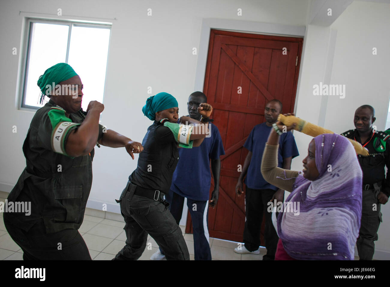 This image captures a self-defense training session for women ...